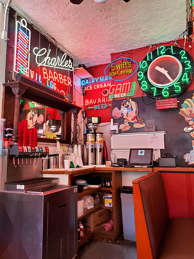 The soda station corner looks like it was decorated by someone who collected every neon sign from every closed ice cream parlor in the Midwest&mdash;and we're here for it.
