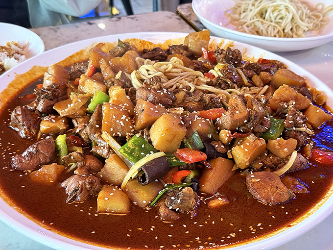 The legendary "Big Plate Chicken" lives up to its name with tender meat, potatoes, and vegetables swimming in a sauce worth bottling and taking home.
