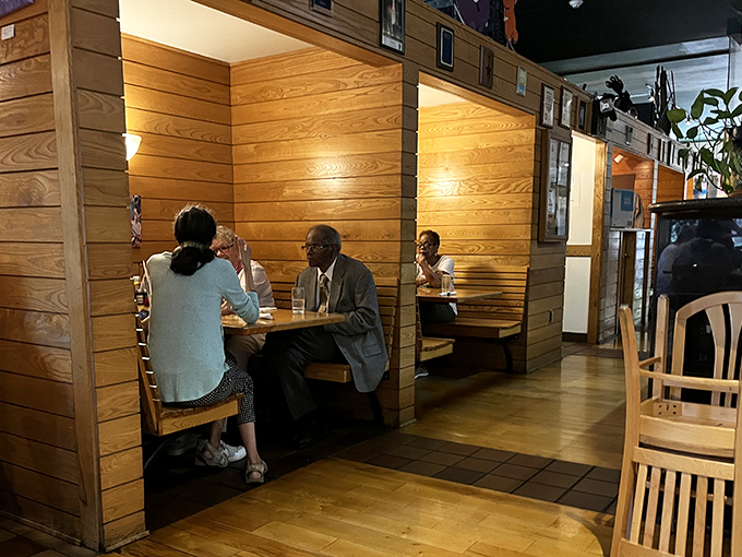 These wooden booths offer the perfect balance of privacy and community&mdash;cozy enough for intimate conversations, yet part of something bigger.