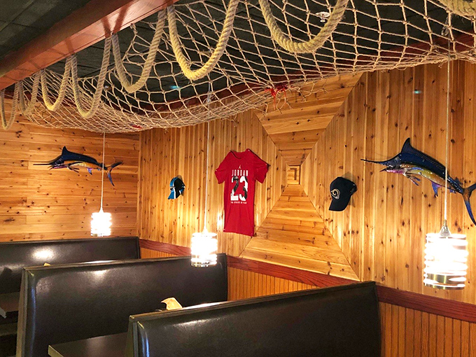 Wooden booths with fishing nets overhead create the perfect backdrop for the seafood drama about to unfold on your table.