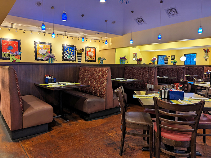 Cozy booths bathed in warm light and cheerful art create the perfect setting for conversations that flow as easily as the coffee refills.