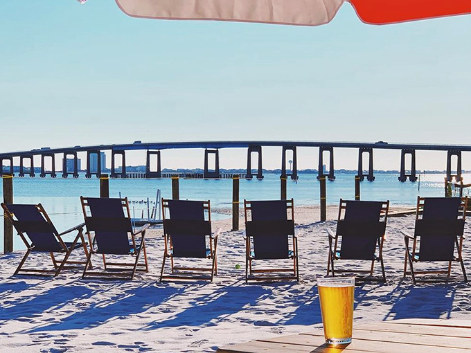 Beach chair philosophy: Six empty seats facing Navarre's bridge invite contemplation, conversation, and that cold beverage you've been promising yourself all year.