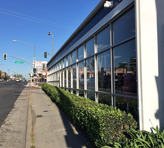 Stretching along Pacific Coast Highway, the store's expansive windows hint at the wonderland of bargains waiting inside.