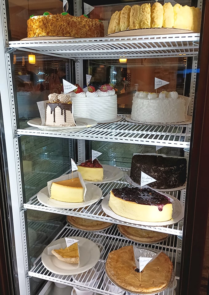 The dessert case &ndash; where willpower goes to die a glorious death. Each cake and pie patiently waiting its turn to become the highlight of someone's day.