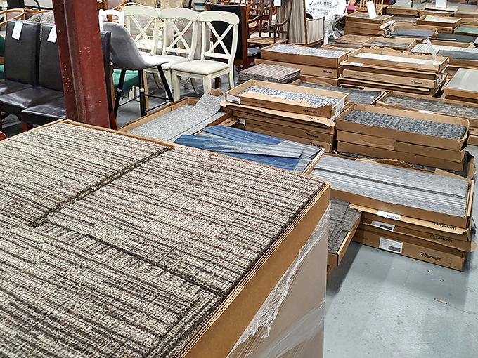 Carpet tiles stacked like pancakes of possibility. The flooring equivalent of a choose-your-own-adventure book, minus the unfortunate endings.