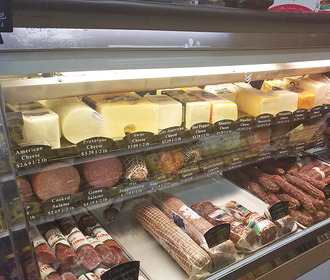 The deli case – where dreams and sandwiches begin. Those meats and cheeses aren't just ingredients; they're the building blocks of happiness.