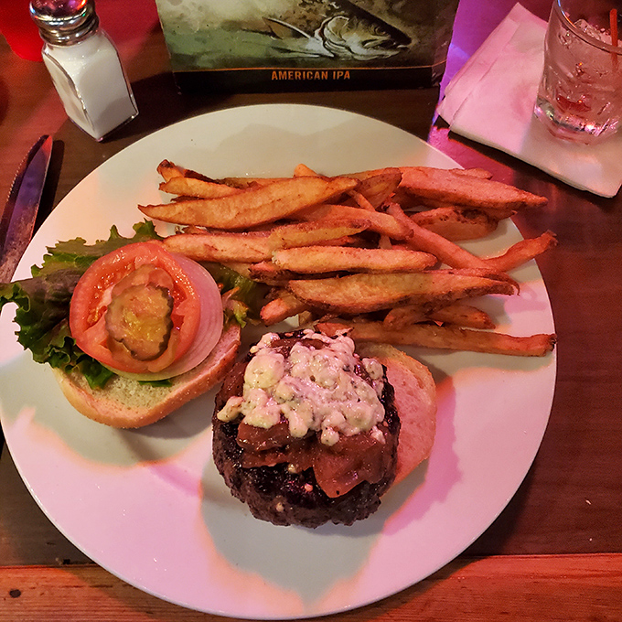 A burger that requires a strategic approach &ndash; compress or unhinge your jaw? Either way, those hand-cut fries are the perfect supporting cast.