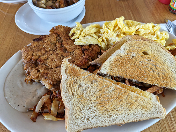Chicken fried steak that could convert vegetarians temporarily. Crispy coating giving way to tender meat under a blanket of gravy that haunts dreams.