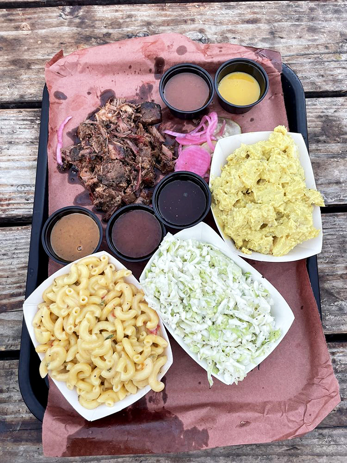A tray that represents the four major food groups: meat, sauce, pickles, and more meat. Barbecue bliss in its purest form.