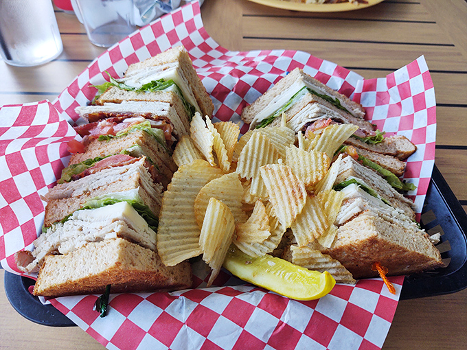 A club sandwich that requires strategic planning to eat. Those layers aren't just stacked&mdash;they're architecturally sound and deliciously precarious.