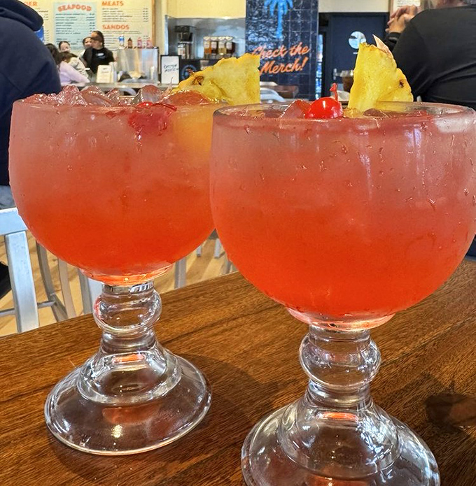 These sunset-colored cocktails aren't just drinks&mdash;they're vacation in a glass, complete with garnishes that say "you deserve this."