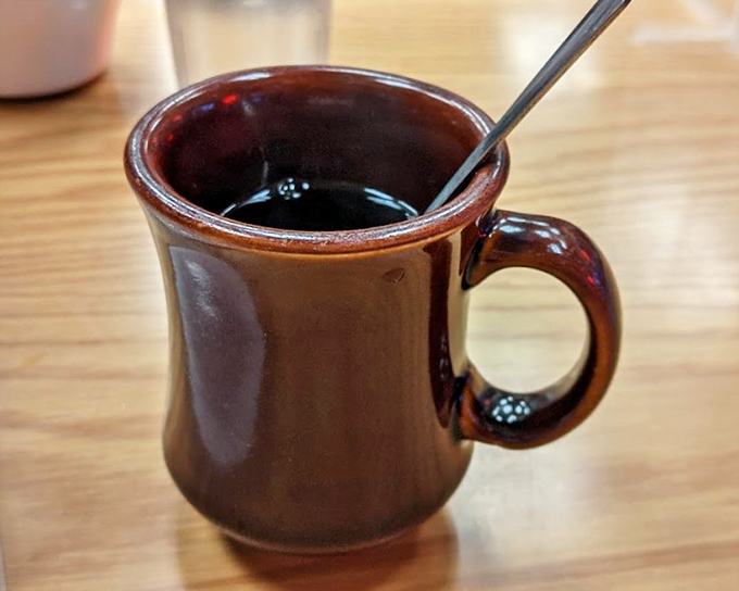 That brown ceramic mug isn't just holding coffee&mdash;it's holding the fuel that powers Portland, one satisfying sip at a time.