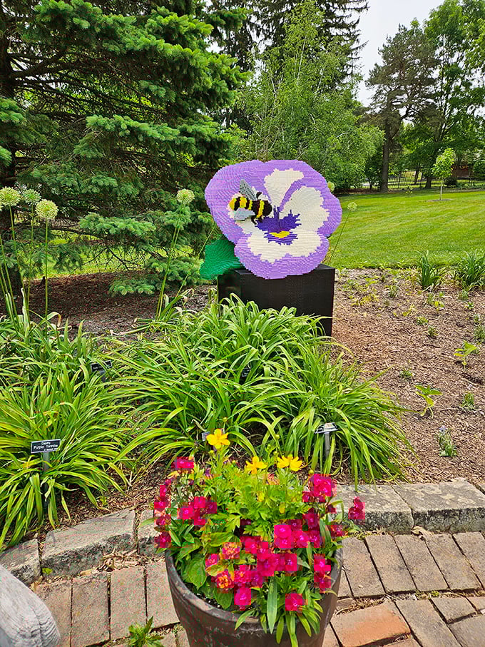 This charming LEGO pansy with visiting bee reminds us that pollinators deserve artistic tribute too&mdash;garden education disguised as delightful sculpture.