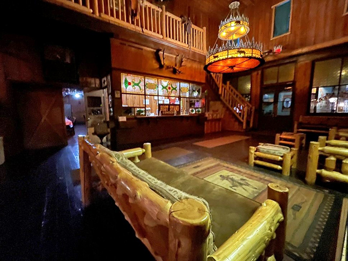 Rustic log furniture and stained glass create a lodge-like atmosphere that whispers, "Stay awhile and eat something substantial."