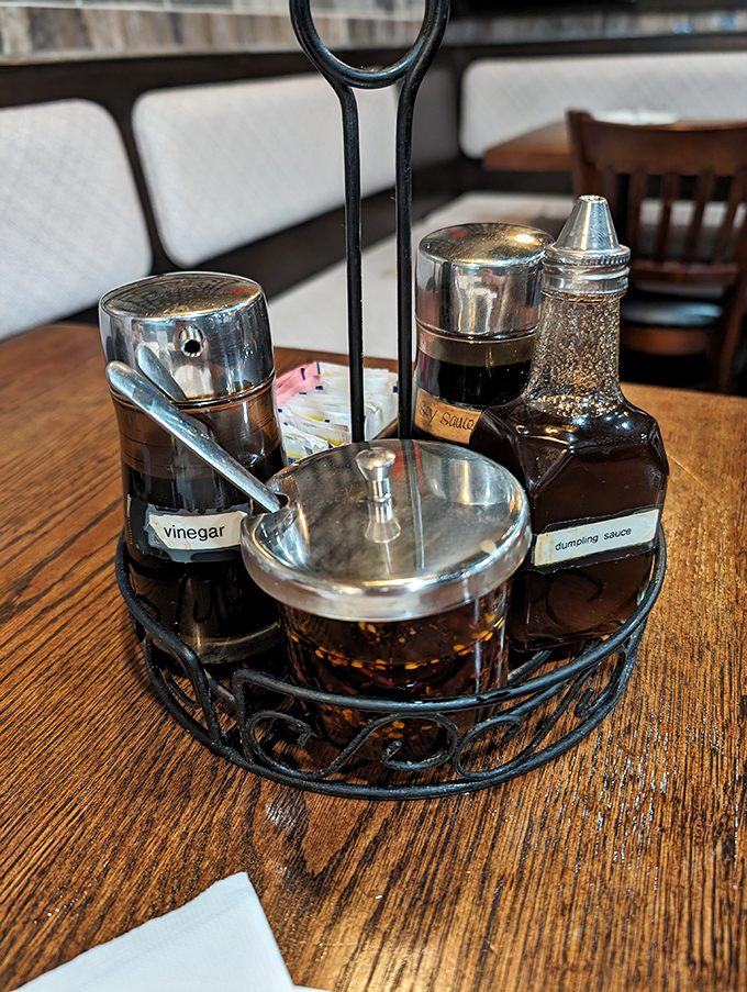 The condiment caddy&mdash;your personal flavor command center. That dumpling sauce is liquid gold that would make Fort Knox jealous.