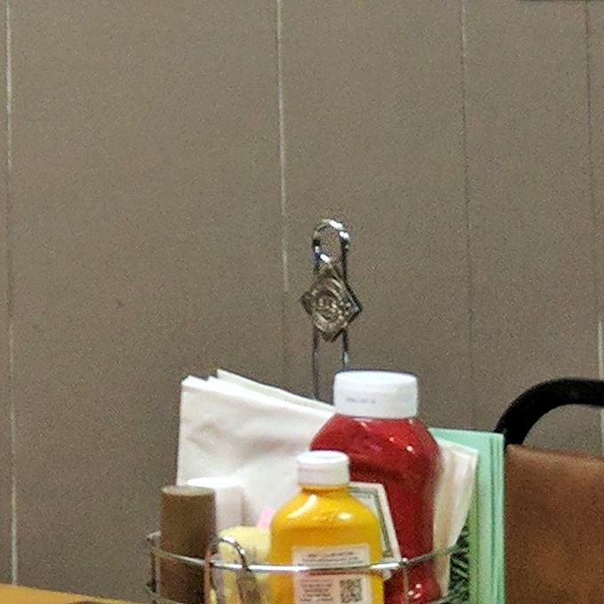 The condiment caddy &ndash; humble ambassadors of flavor that complete the Heinnies experience. Even the ketchup and mustard feel special here.