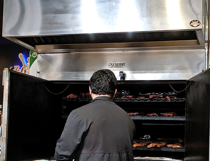 A glimpse into the sacred space where smoke meets meat. Like watching Michelangelo paint, but with more fire and significantly better eating opportunities.