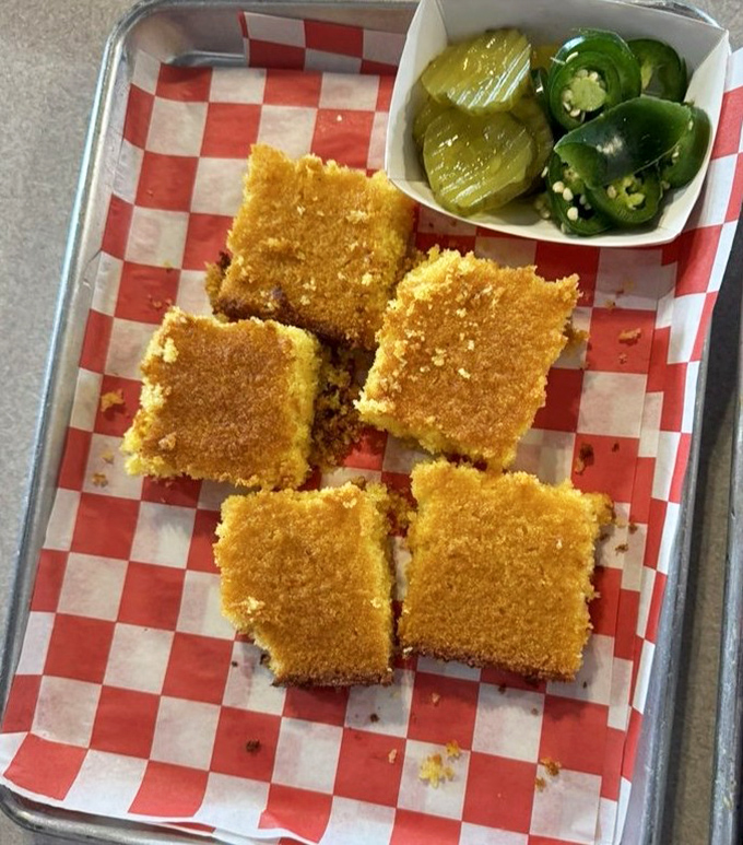 Cornbread squares that achieve the impossible: somehow both crumbly and moist, with jalape&ntilde;os standing by for those brave enough.