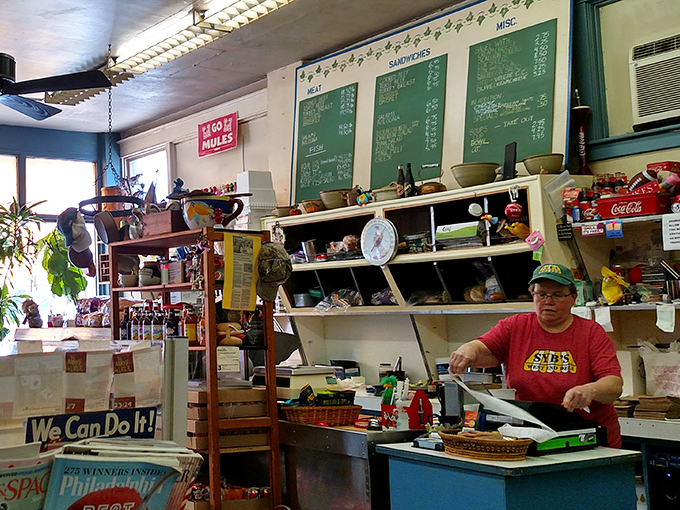 Behind every great deli is someone who knows exactly how much mustard belongs on your sandwich. The menu board's handwritten charm is no accident.