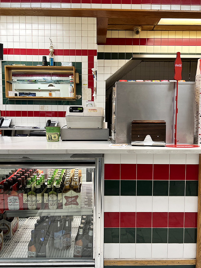 Command central where pizza orders become reality. The red, white, and green tiles silently whisper, "You're in good Italian hands."