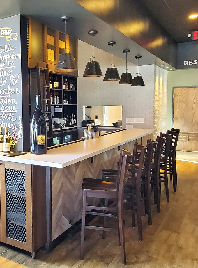 The counter invites solo diners and couples to watch the bartending ballet while sipping something that pairs perfectly with people-watching.