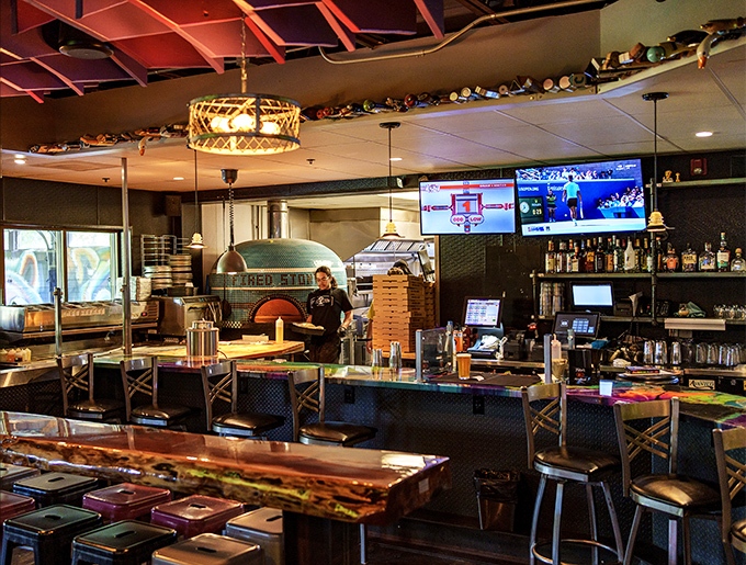 The bar area reveals the true star &ndash; that magnificent tiled oven visible from every seat, promising smoky delights to come.