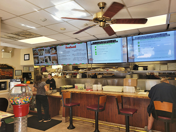 The counter service area offers a glimpse into the kitchen's choreography, where everyday magic happens between order and plate.