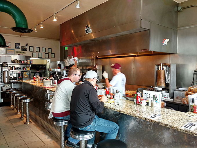 Counter seating: where solo diners become temporary family and the kitchen's symphony plays just for you. Front-row seats to breakfast magic.