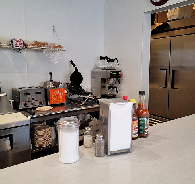 The beating heart of breakfast operations &ndash; where coffee percolates with purpose and napkin dispensers stand ready for the inevitable delicious mess.