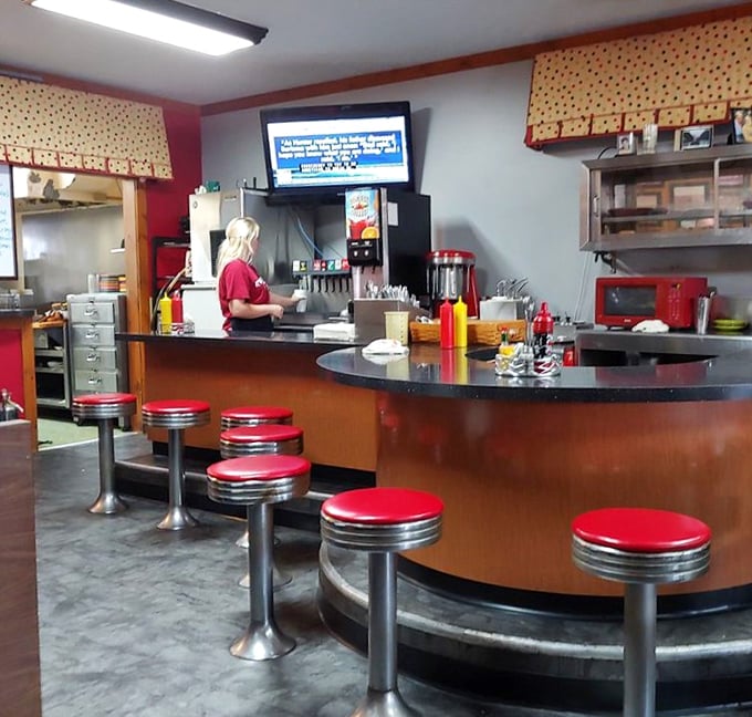 The counter seats at Nick's are front-row tickets to culinary theater. Red vinyl stools have supported generations of Hoosiers enjoying life one bite at a time.