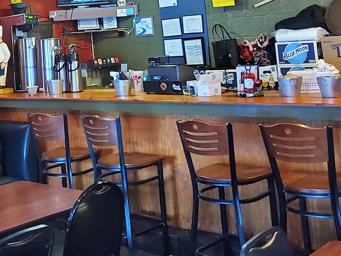 Counter seating for solo diners who know that good food needs no company except appetite.