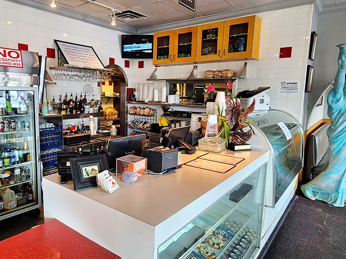Behind the counter, where deli magic happens&mdash;a miniature Statue of Liberty stands guard, ensuring New York standards are maintained in Southern territory.