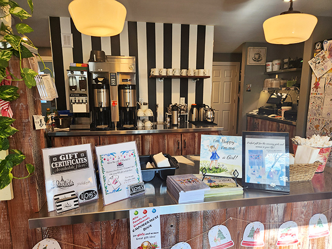 Where coffee dreams come true behind black and white stripes. This counter serves up liquid motivation alongside gift options for fellow crepe enthusiasts.
