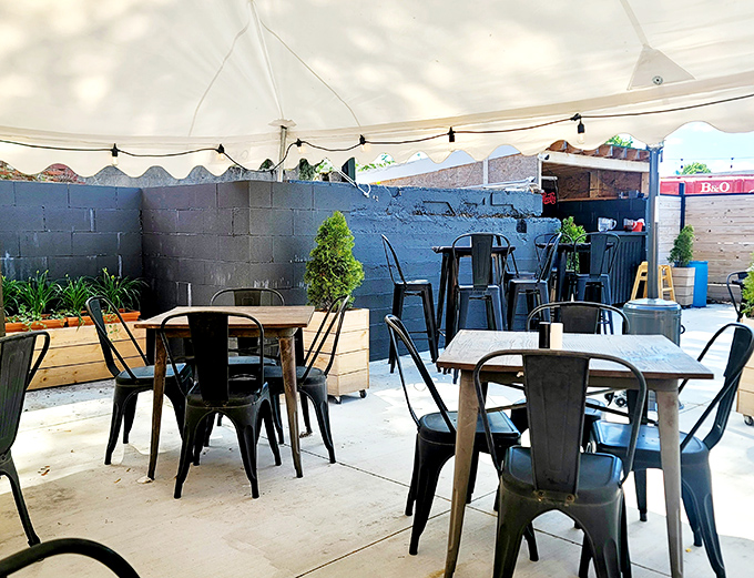 Outdoor seating that feels like your coolest friend's backyard party. Those metal chairs have supported countless happy diners enjoying Ohio's perfect summer evenings.
