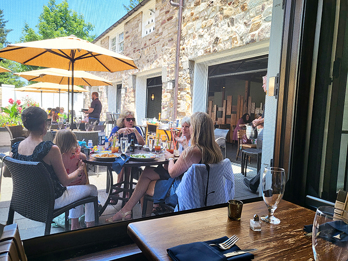 Conversations flow as freely as the wine on this sun-dappled patio&mdash;the true ingredient in memorable dining experiences.