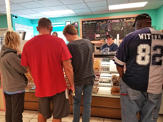The morning pilgrimage &ndash; locals patiently waiting their turn at the counter. The anticipation is half the fun... almost.