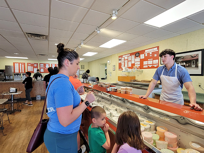 The timeless ritual of children selecting their flavor while parents pretend they're not going to order something too. Some traditions never need updating.