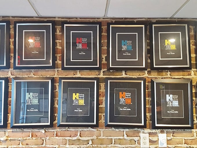 A wall of awards that tells you what locals already know: The Pizza Grille has been collecting fans and accolades for years like some collect refrigerator magnets.