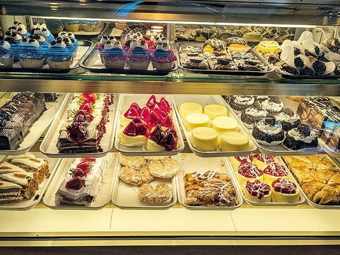The dessert case: where willpower goes to die a glorious death. Each tray contains a different way to justify "just a little something sweet."