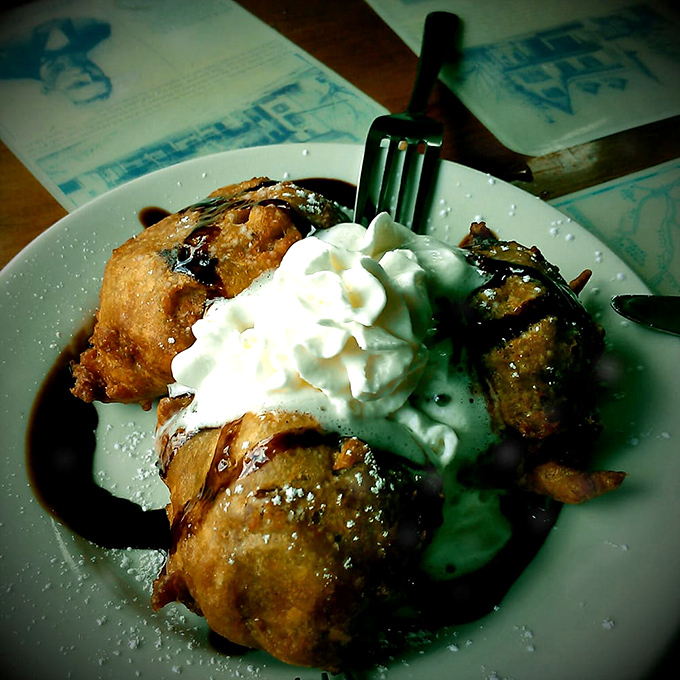 Deep-fried happiness topped with whipped cream—proof that dessert isn't just a meal course, it's a love language spoken fluently at Daddypops.