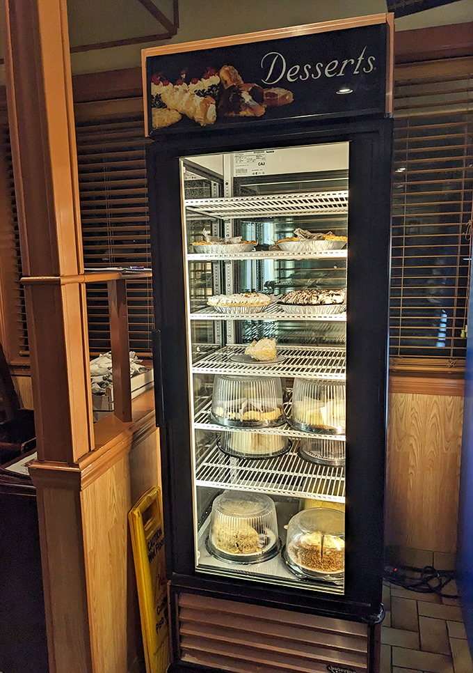 The dessert case&mdash;where willpower goes to die a delicious death. Each shelf a different chapter in the story of why pants have elastic waistbands.