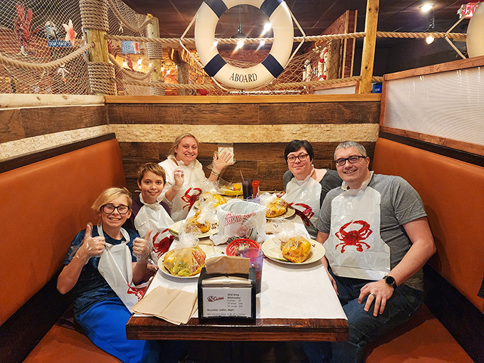 Happy diners sporting bibs and smiles&mdash;the universal uniform of people about to enjoy a seriously good seafood feast.