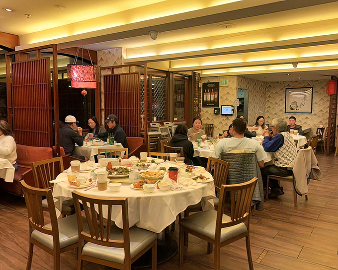 Round tables foster the sharing spirit that defines the Newport experience&mdash;where passing plates becomes a delicious choreography.