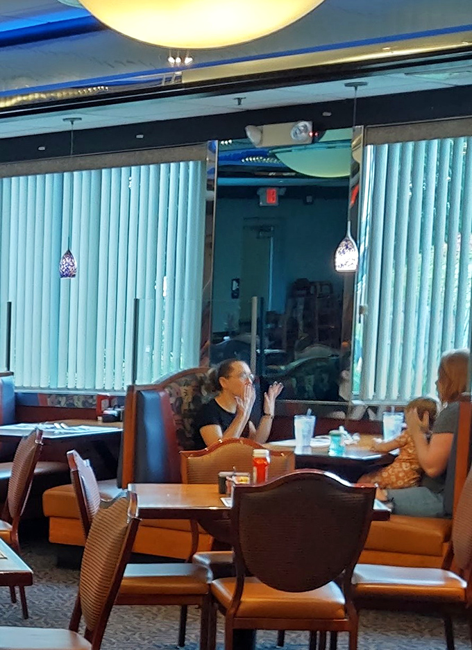 Fellow diners enjoying the kind of leisurely breakfast conversations that make mornings worth celebrating together.