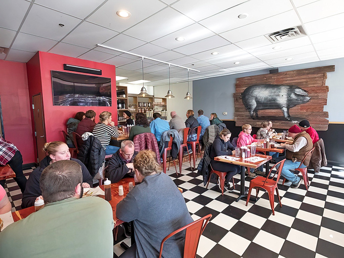 A packed house of happy diners under the watchful eye of the wooden pig &ndash; a scene that repeats daily in this meat-lovers' sanctuary.