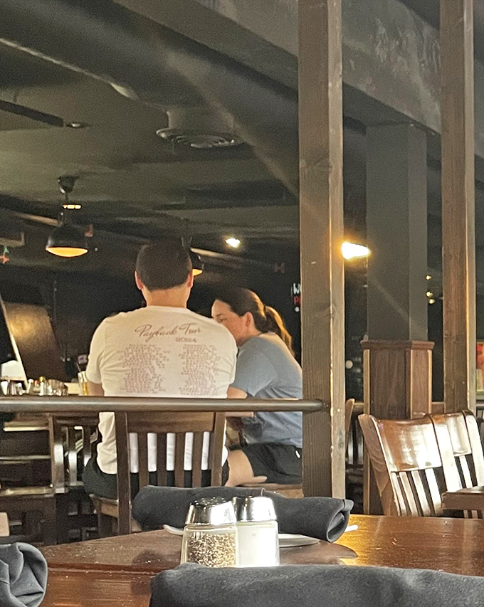 Every table tells a story at Steam Pub, where diners lean in over good food, creating memories one bite at a time.