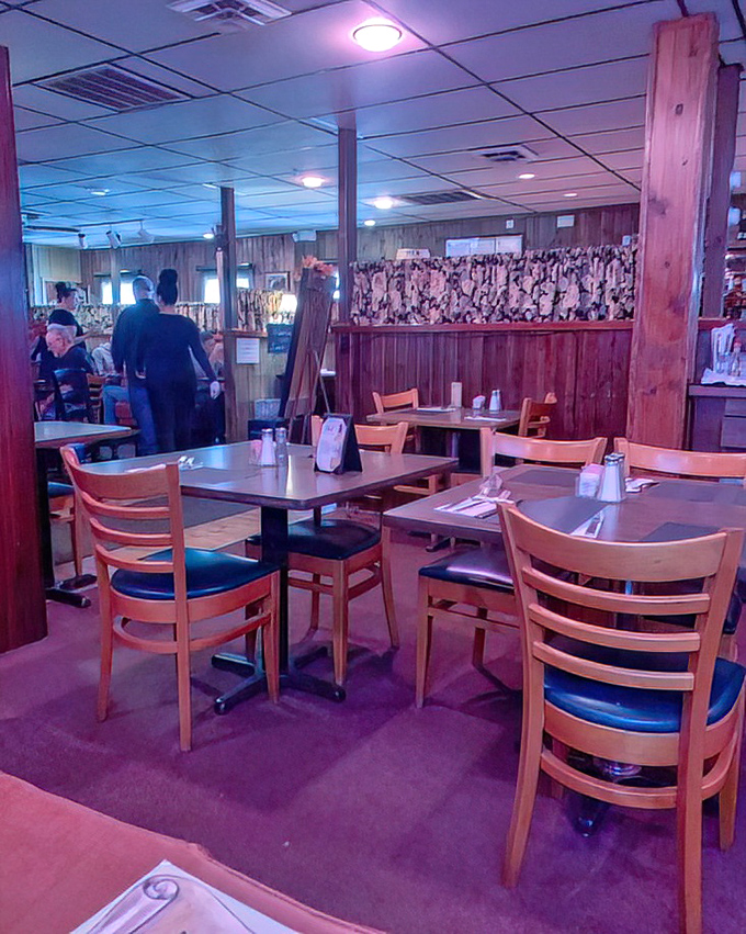 The dining room awaits its evening guests. Those wooden chairs have supported thousands of happy diners through countless "I can't eat another bite" moments.