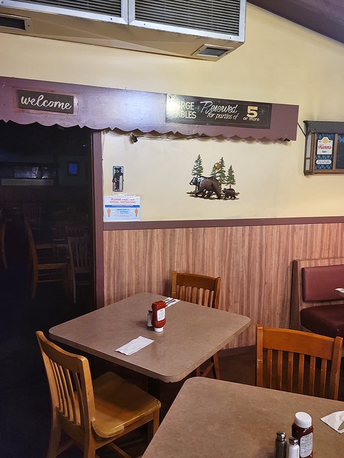 Simple wooden tables and chairs that have supported countless elbows, animated conversations, and the weight of "I shouldn't have ordered that third rib" regrets.