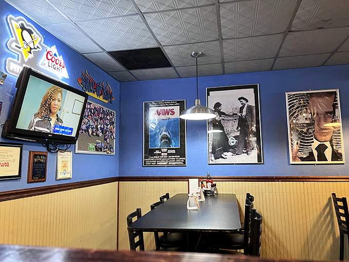 Classic movie posters from Jaws to The Twilight Zone create a dining space where nostalgia is served alongside every meal.