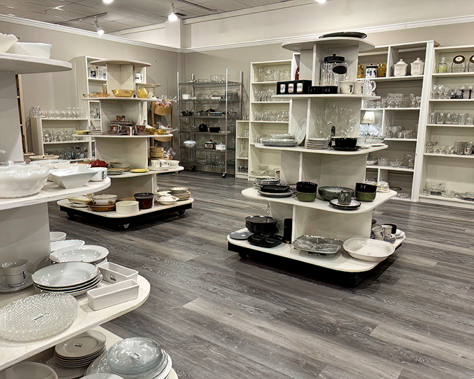 A well-organized display of elegant dining ware and kitchen essentials, offering timeless pieces for your table.